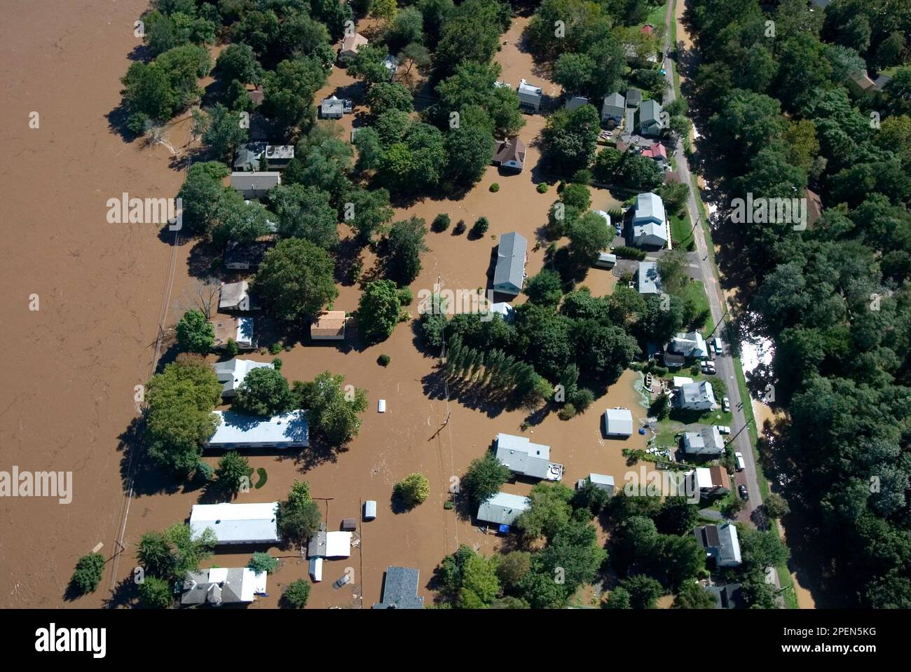 The swollen Delaware River inundates Lower Makefield Township, Pa., as ...
