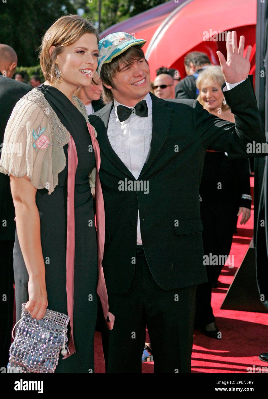 Actor Jason Ritter, right, of "Joan of Arcadia" waves during his ...