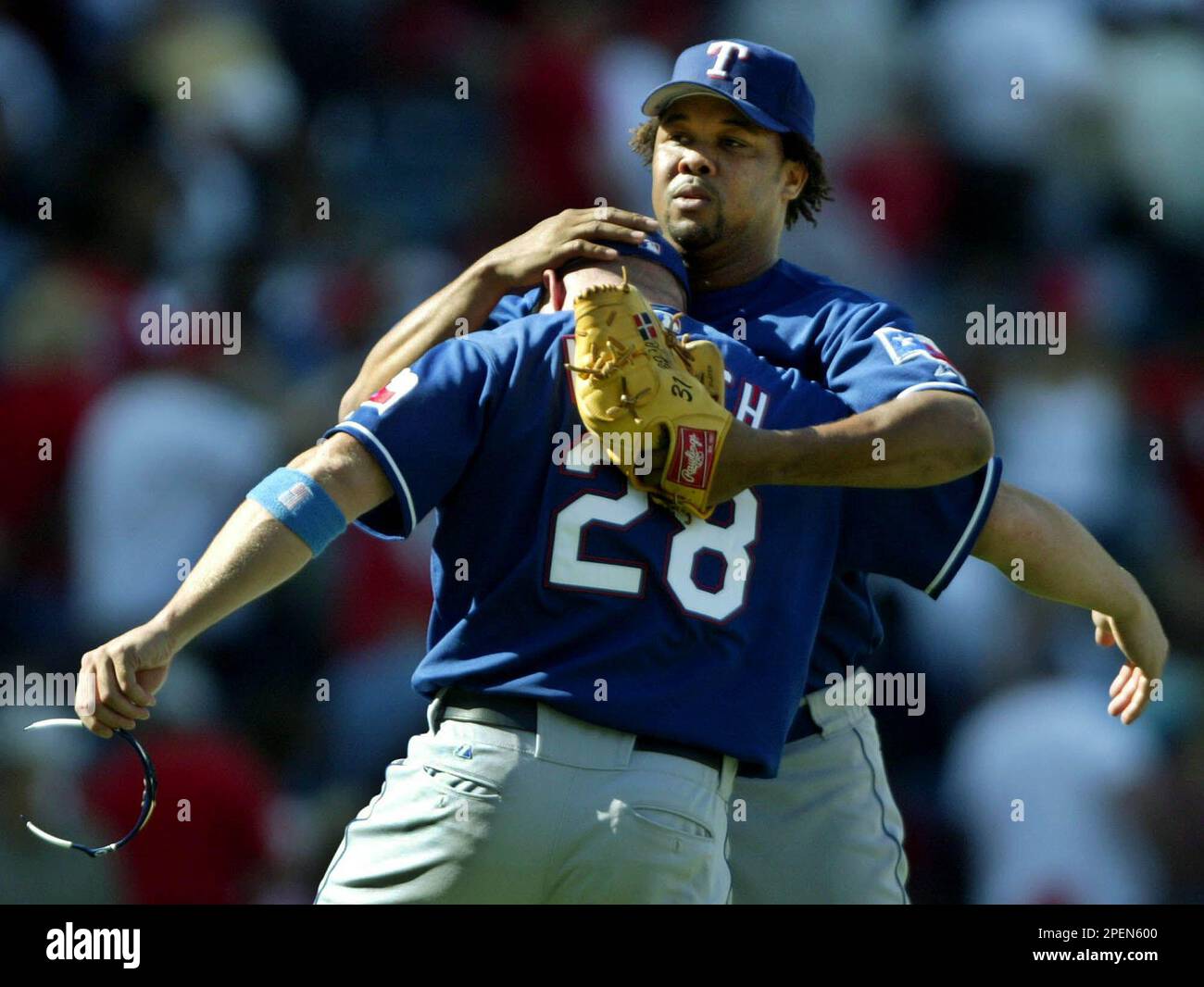 Texas Rangers pitcher Francisco Cordero, right, celebrates with Kevin ...