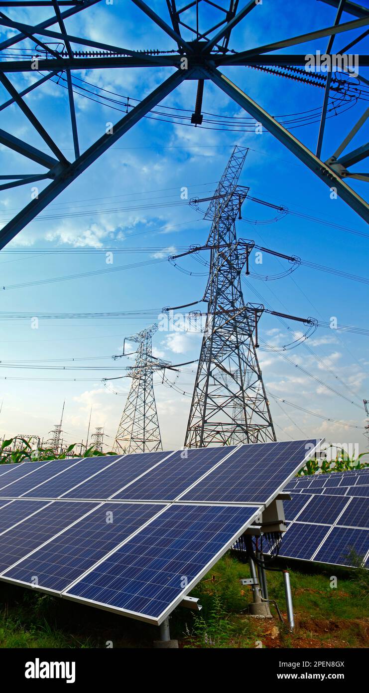 Solar panels and pylon, green environmental protection Stock Photo - Alamy