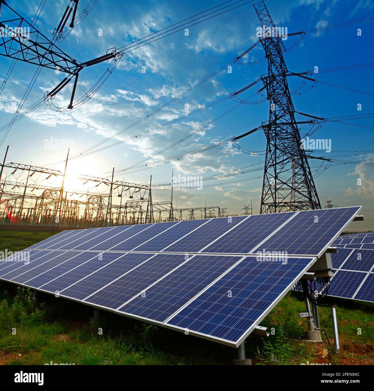 Solar panels and pylon, green environmental protection Stock Photo - Alamy