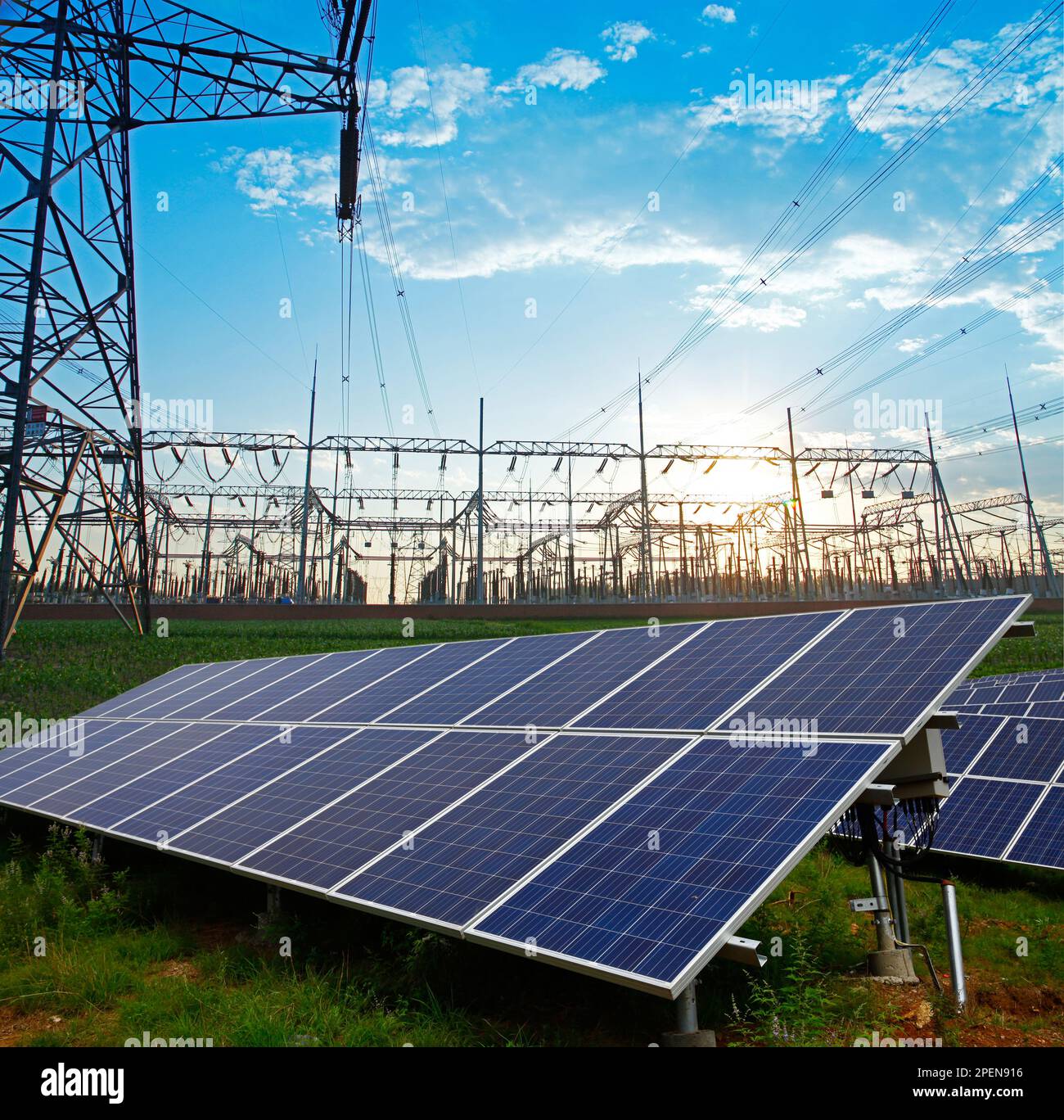 Solar panels and pylon, green environmental protection Stock Photo - Alamy