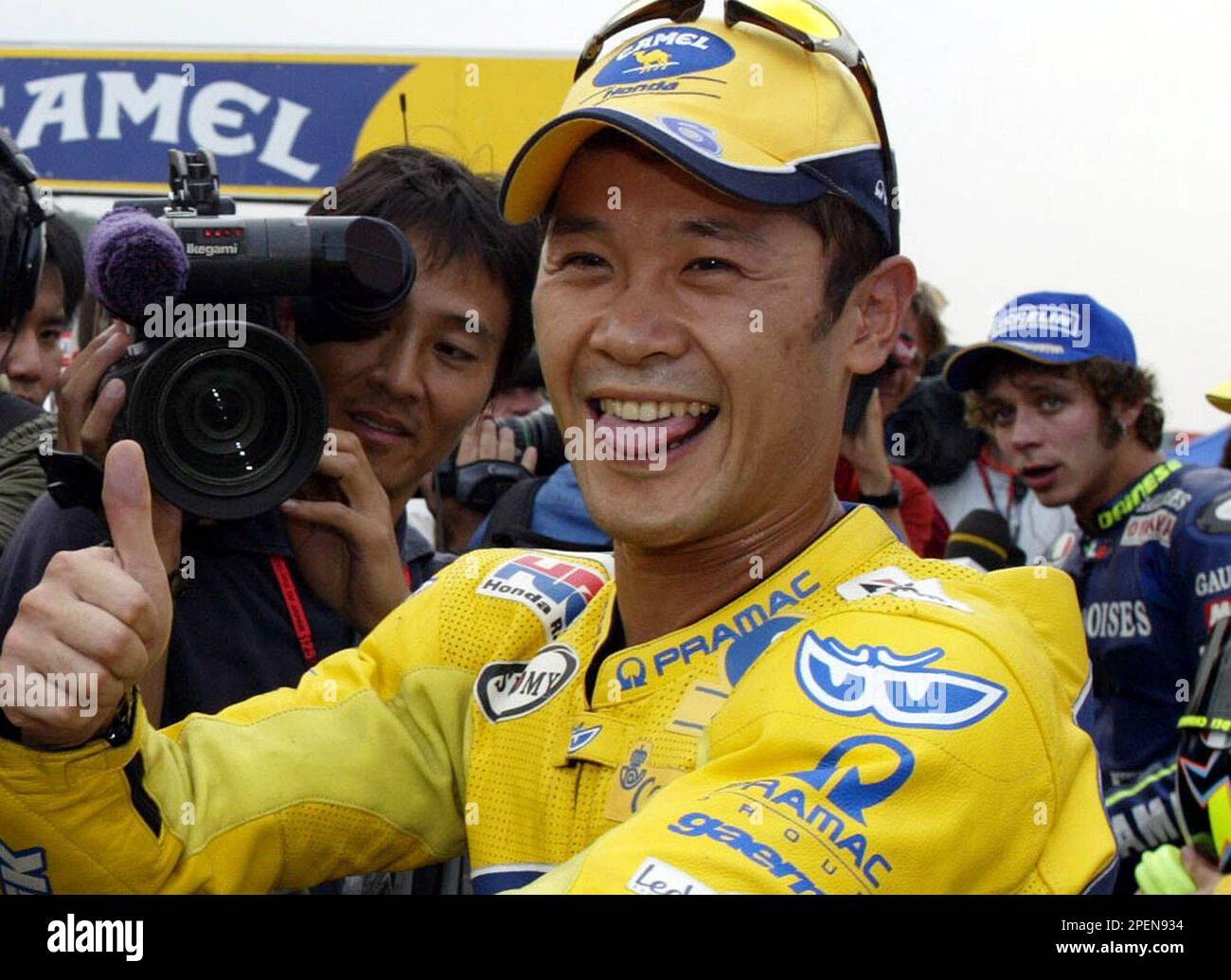 Japanese MotoGP rider Makoto Tamada gives the thumb-up after clinching ...
