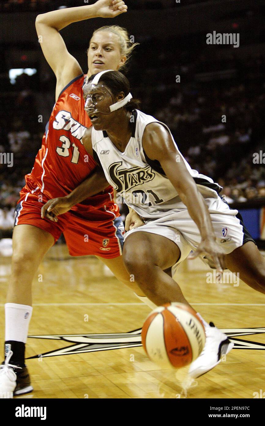 San Antonio Silver Stars' Semeka Randall (21) drives past Charlotte ...