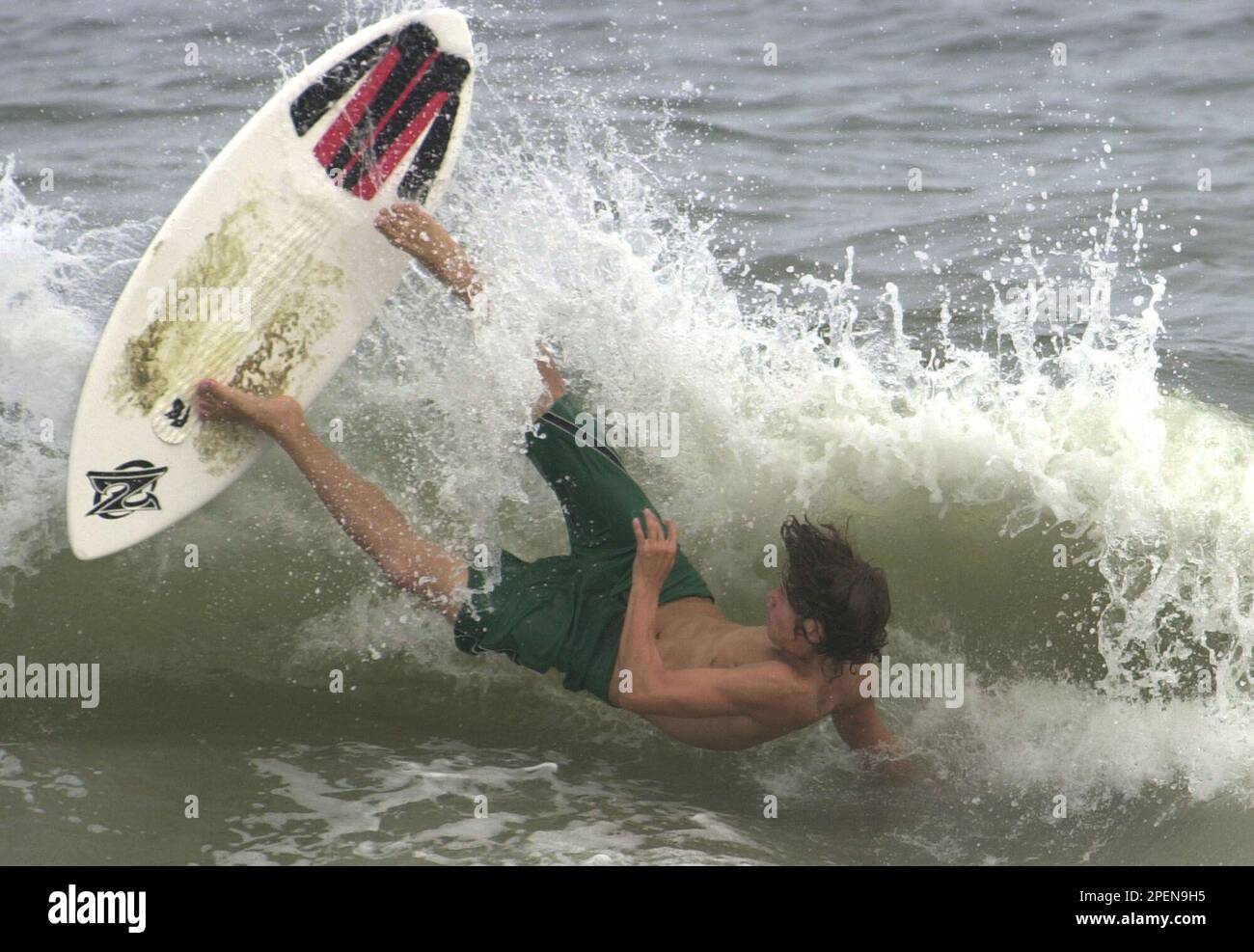 Danny Smith of Freehold, N.J., wipes out on his skim board while riding ...