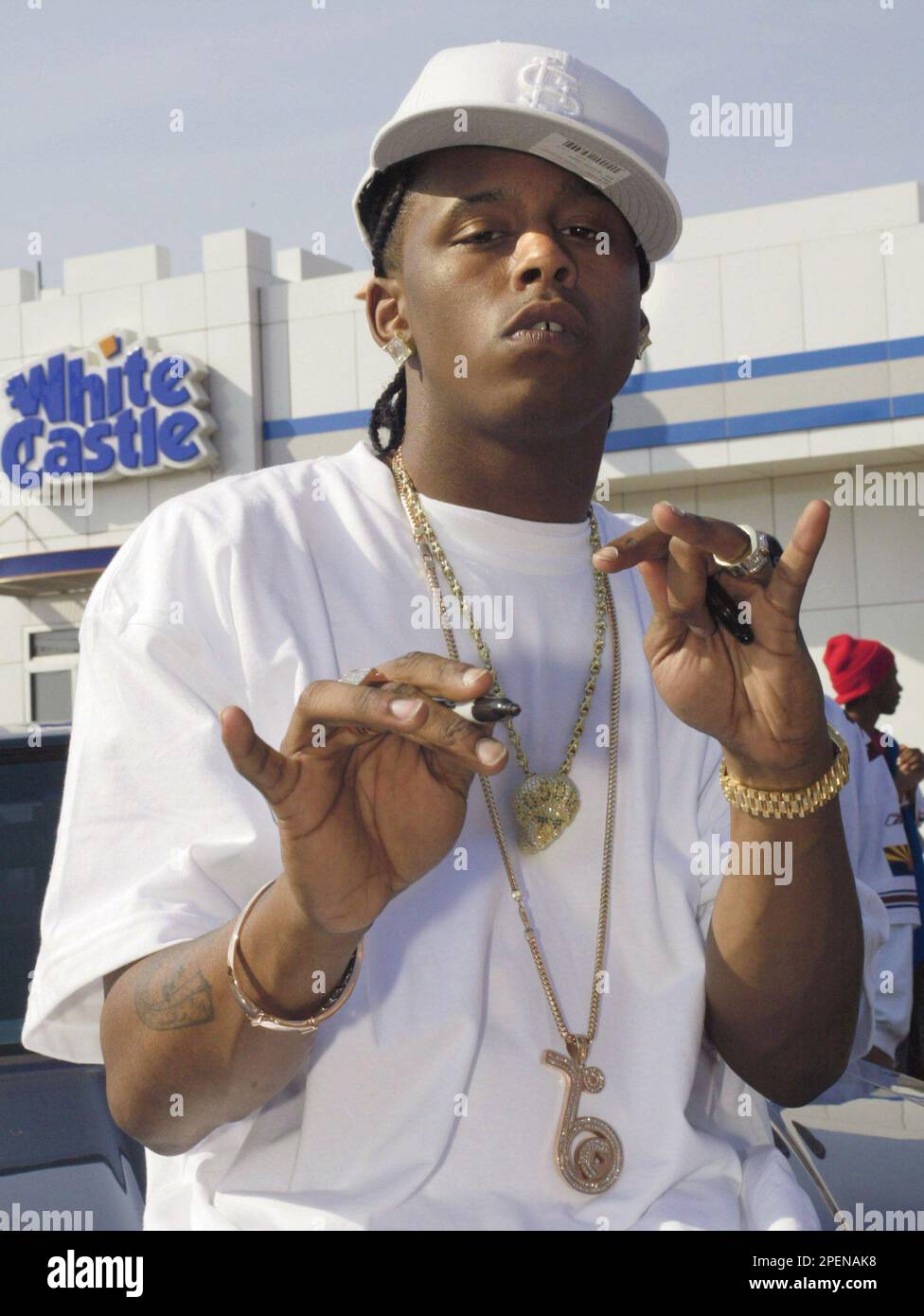 ** FILE ** Rapper J-Kwan poses in front of his favorite White Castle ...