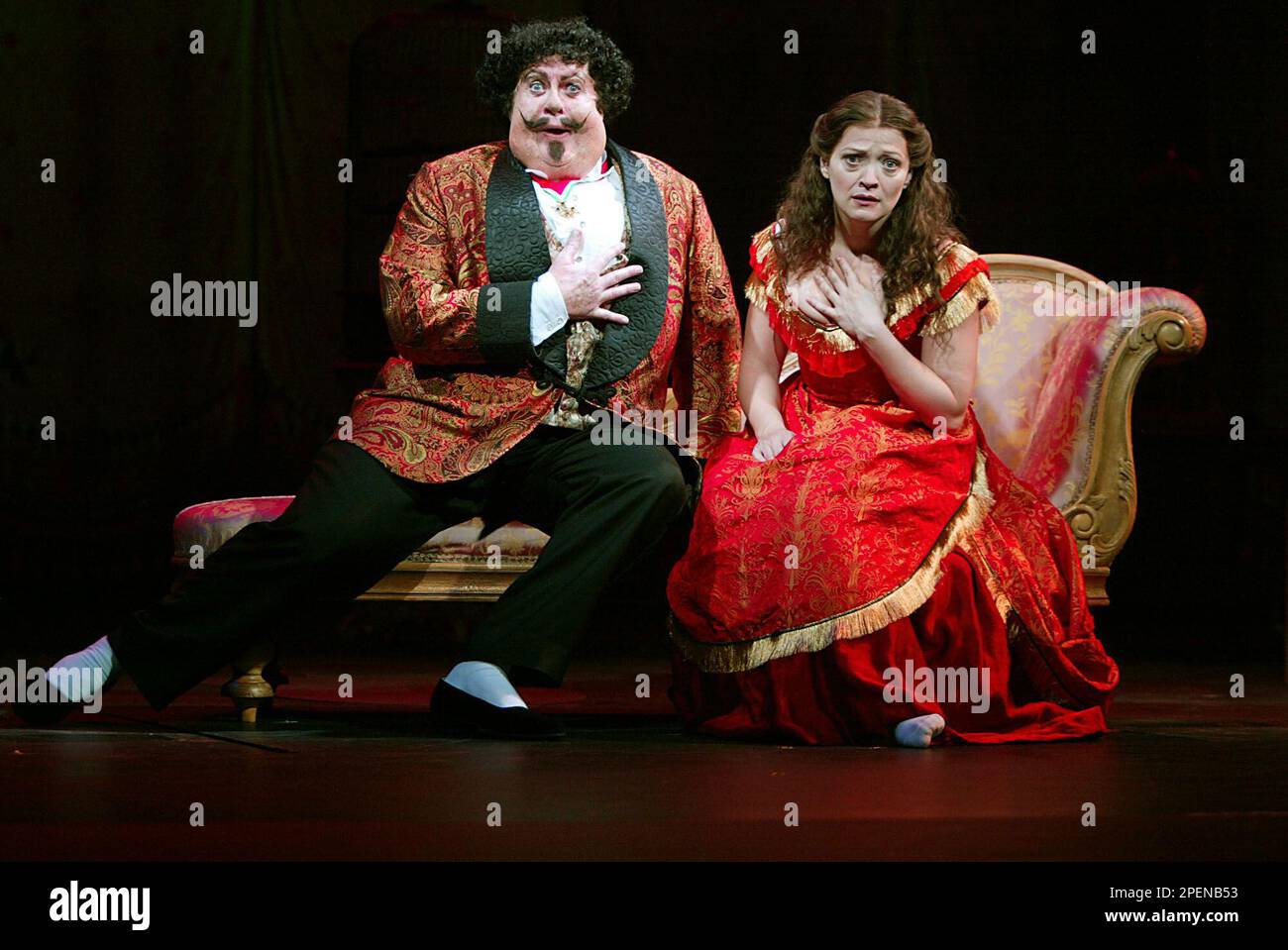 A heavily made-up Michael Crawford, playing Count Fosco, sits with ...
