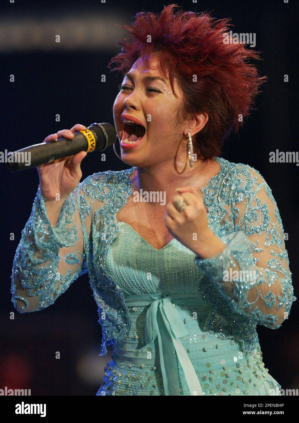 Joy Destiny Tobing sings after she is announced as the winner of ...