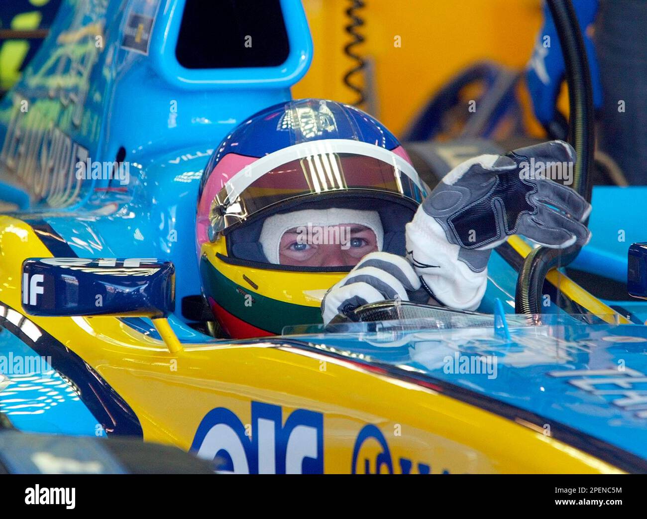 Canadian F1 racing driver Jacques Villeneuve pulls on his gloves at the ...