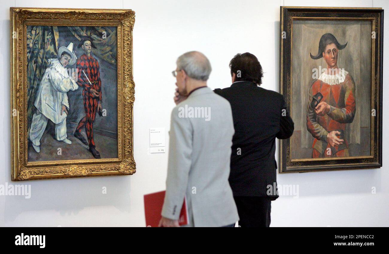 Zwei Besucher bestaunen das Bild "Mardi Gras" von Paul Cezanne, links ...