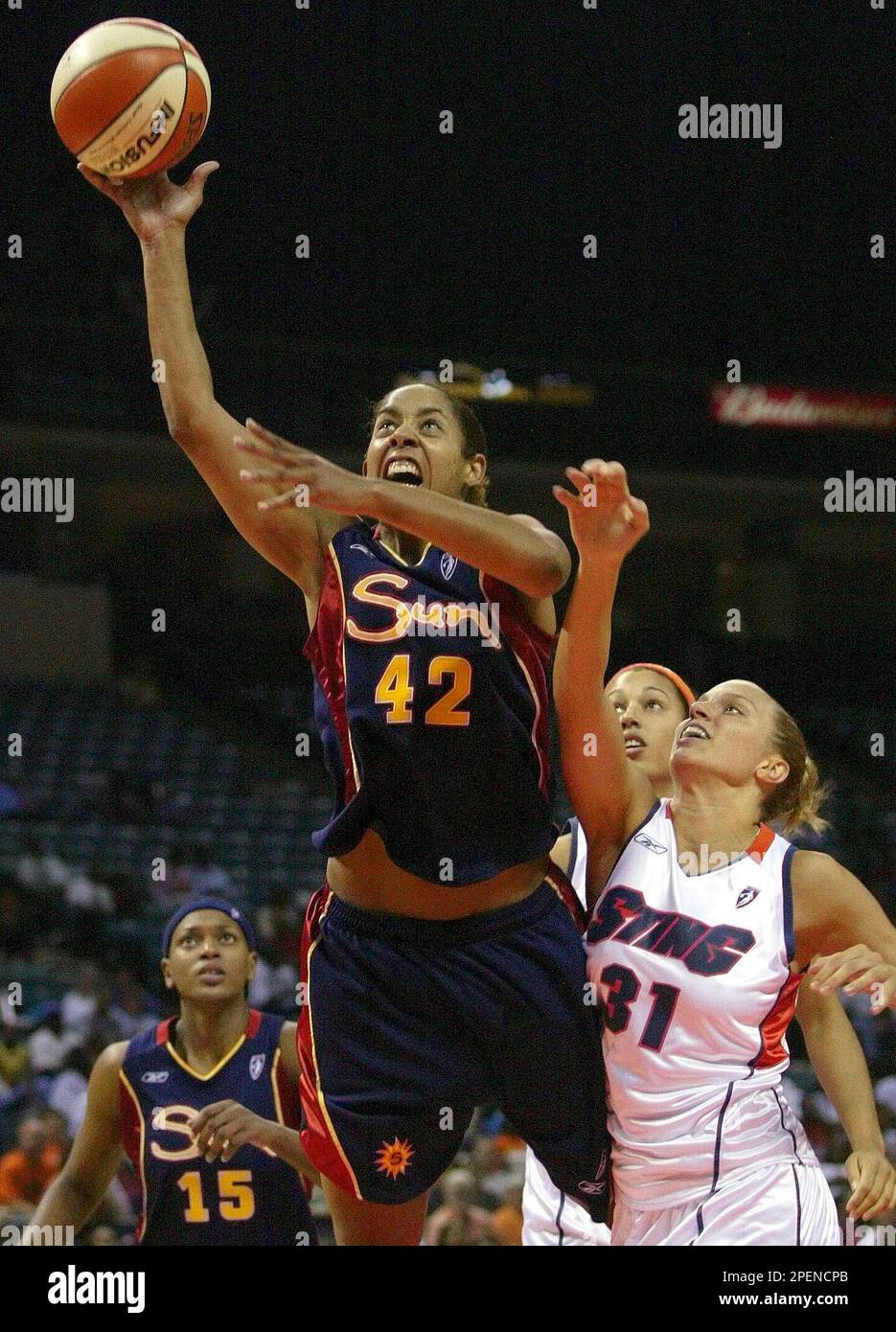 Connecticut Sun's Nykesha Sales (42) drives to basket past Charlotte ...