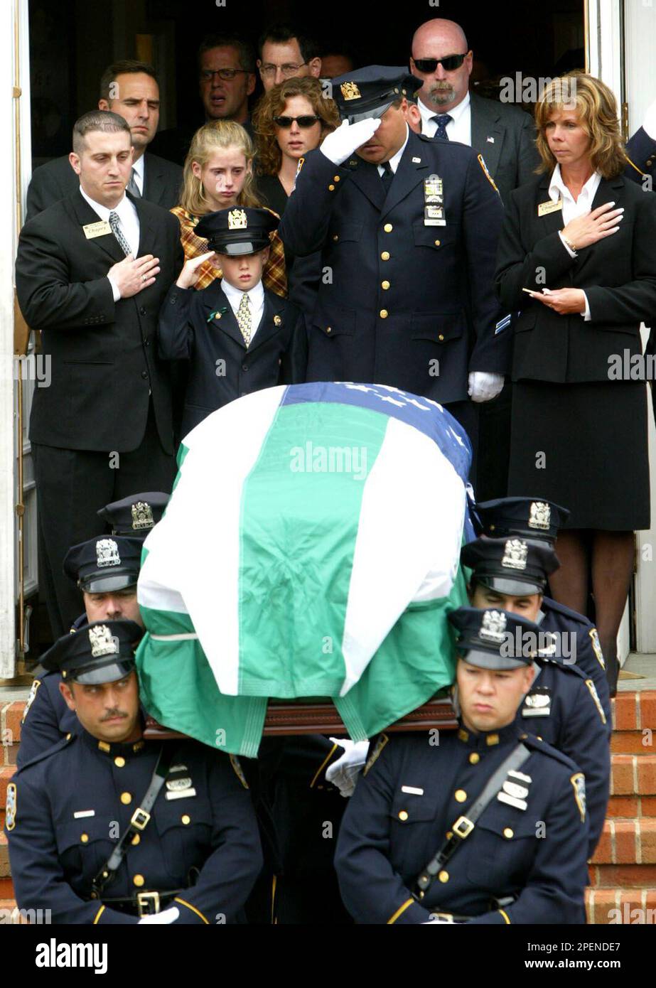 The casket of Detective Patrick Rafferty is carried from his funeral ...