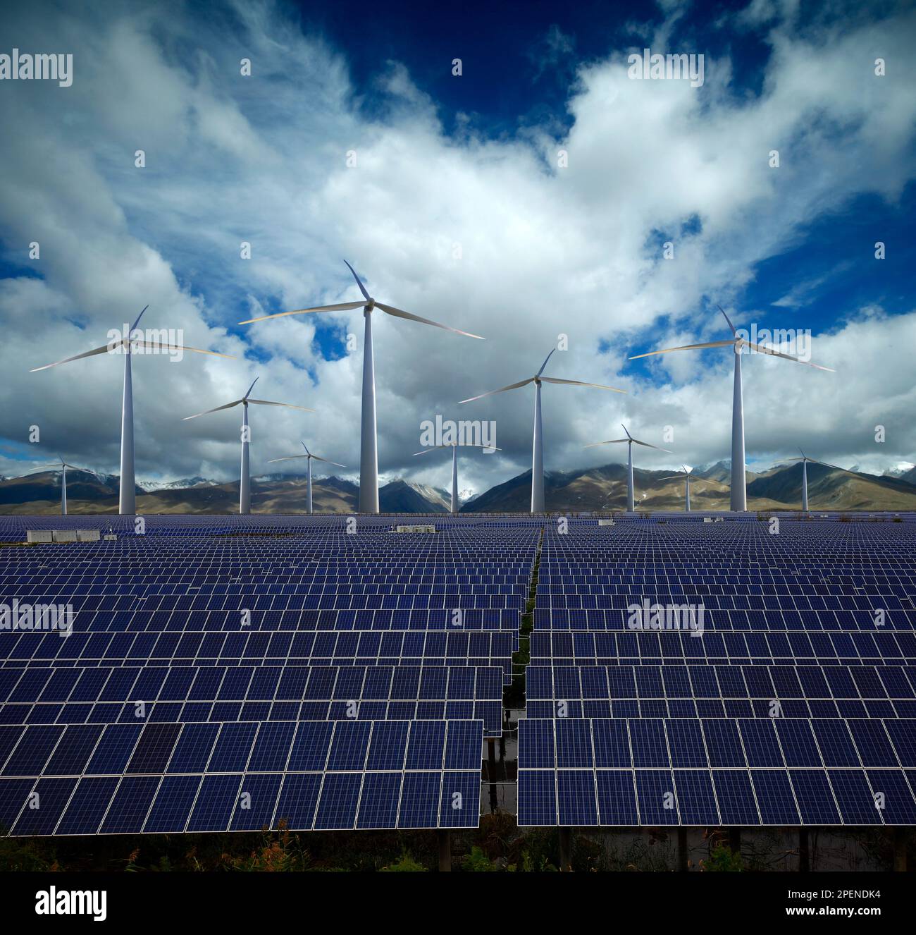 Solar photovoltaic panels and wind turbines. Energy concept Stock Photo ...