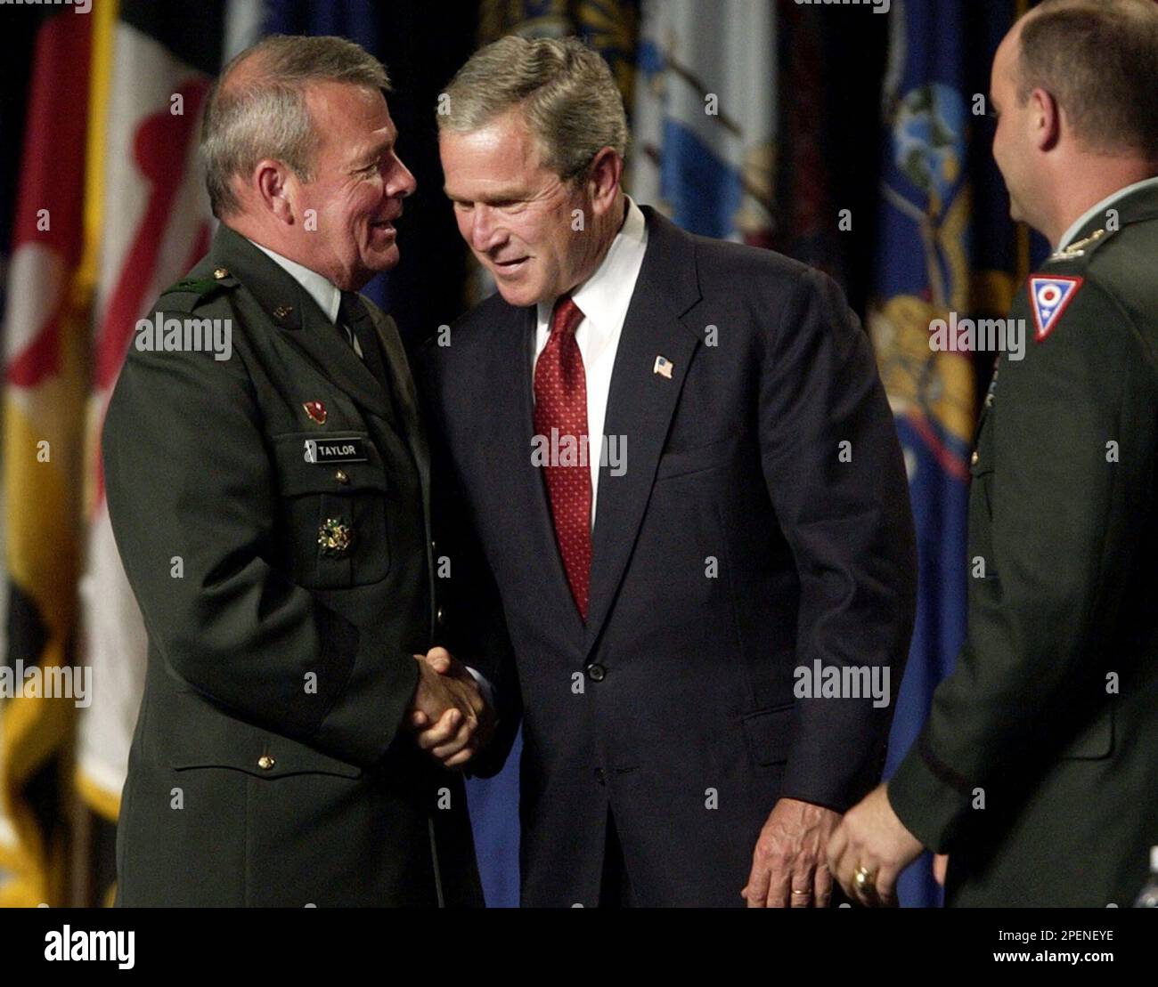 President Bush shakes hands with Brig. Gen. Robert Taylor as Col. Al ...