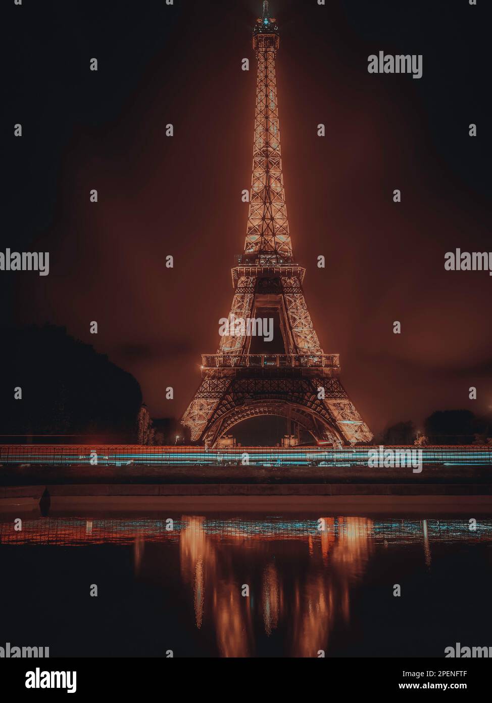 A glowing Eiffel Tower illuminating the night sky, captured from the ...