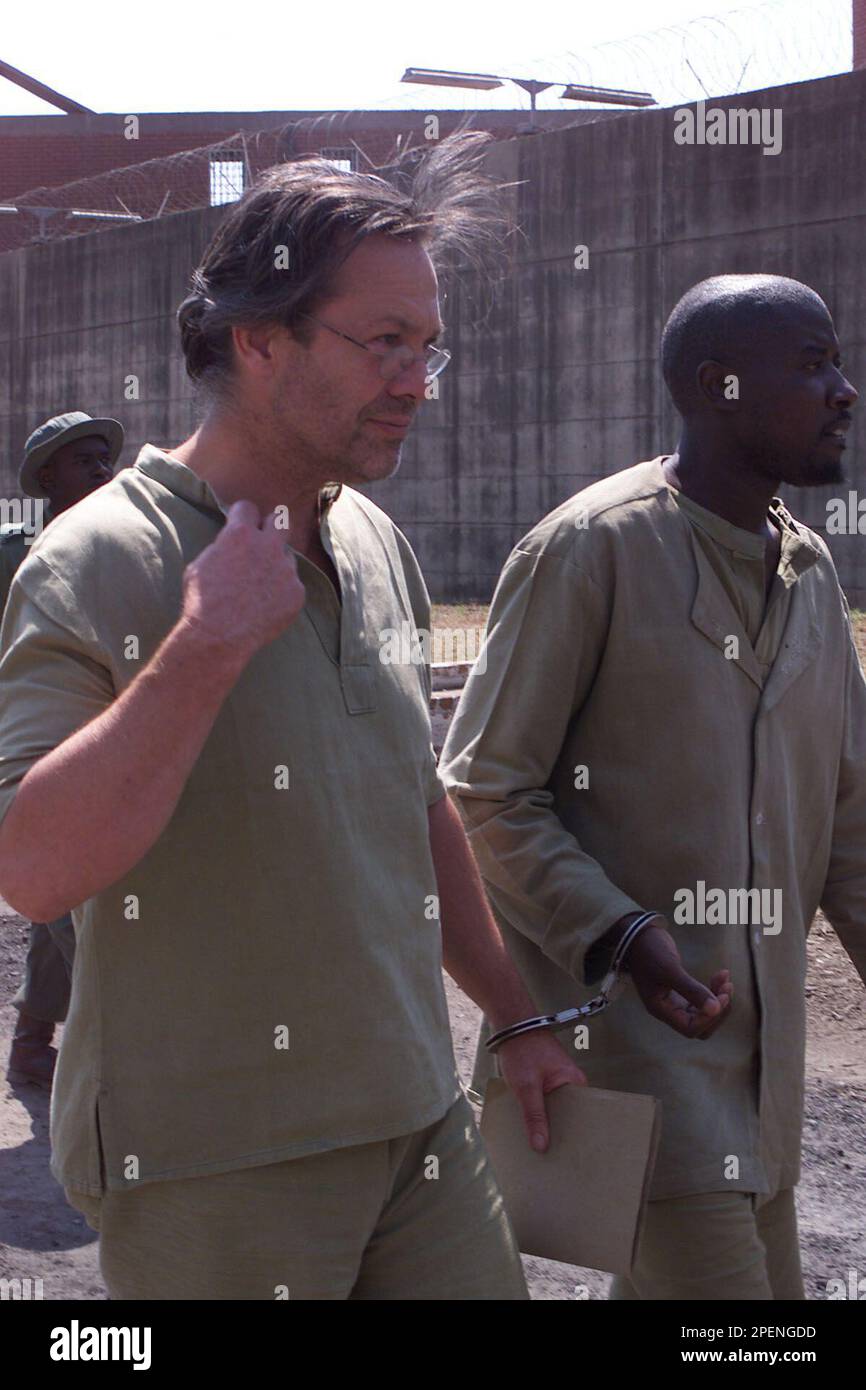 Former British special forces soldier Simon Mann,left, is seen at ...