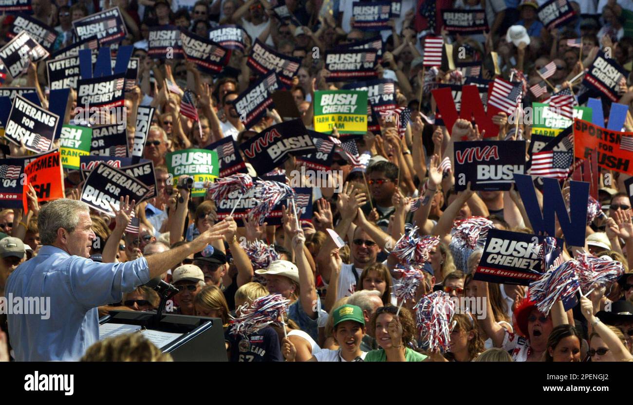President Bush rallies the crowd at a campaign event in Holland, Mich ...