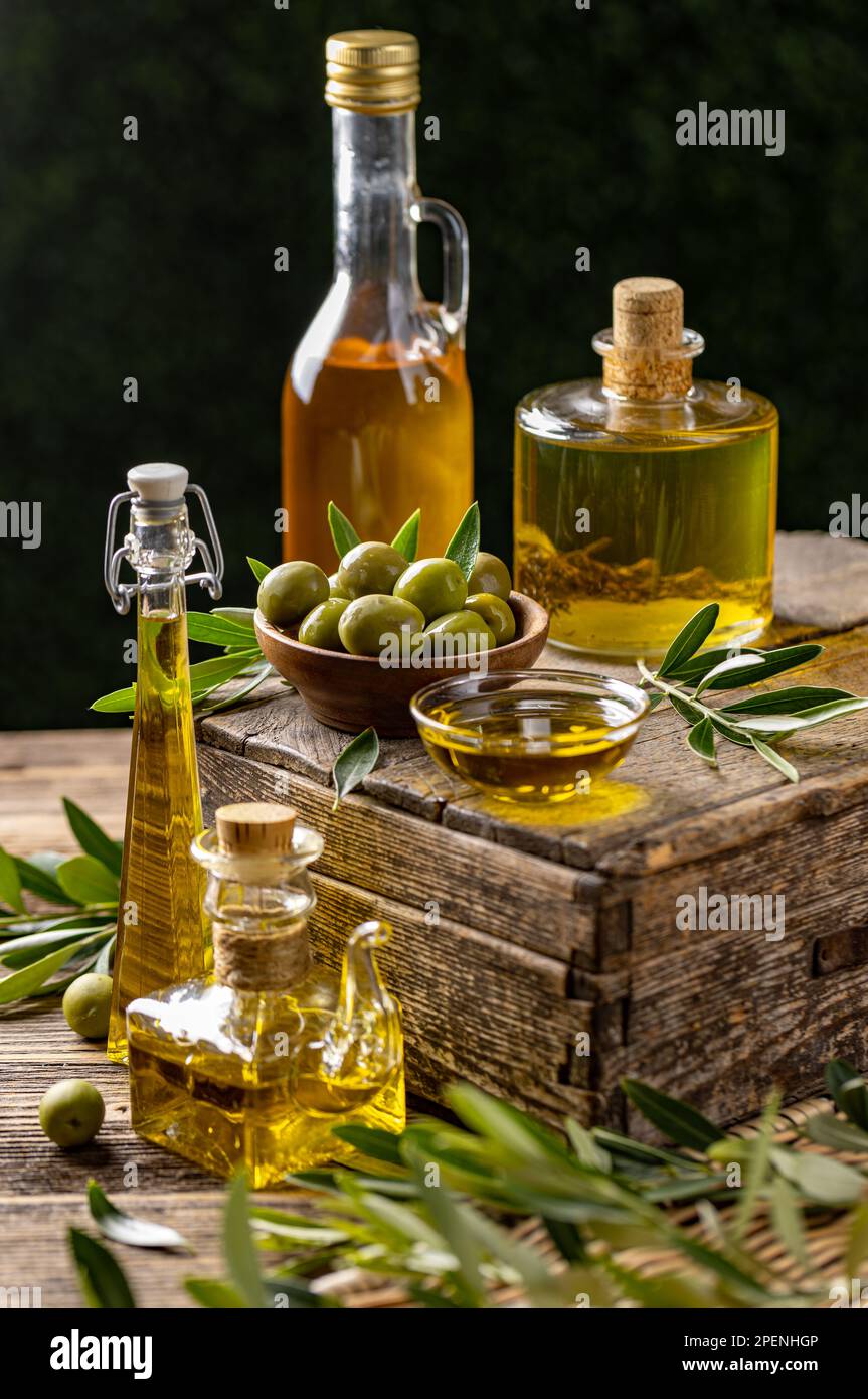 Extra virgin healthy olive oil with fresh olives, still life ...
