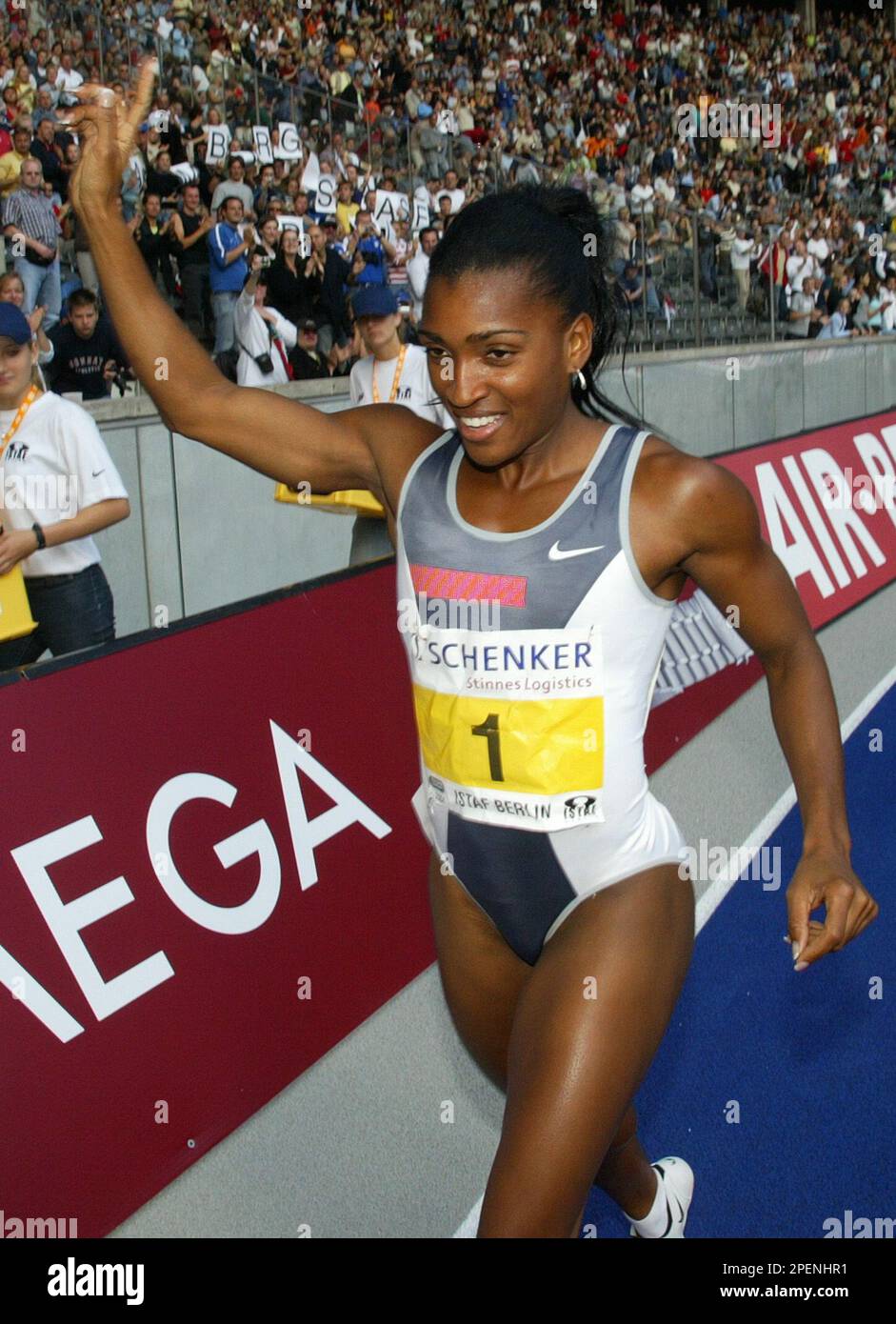 Tonique Williams-Darling, of the Bahamas ,celebrates after she won the ...