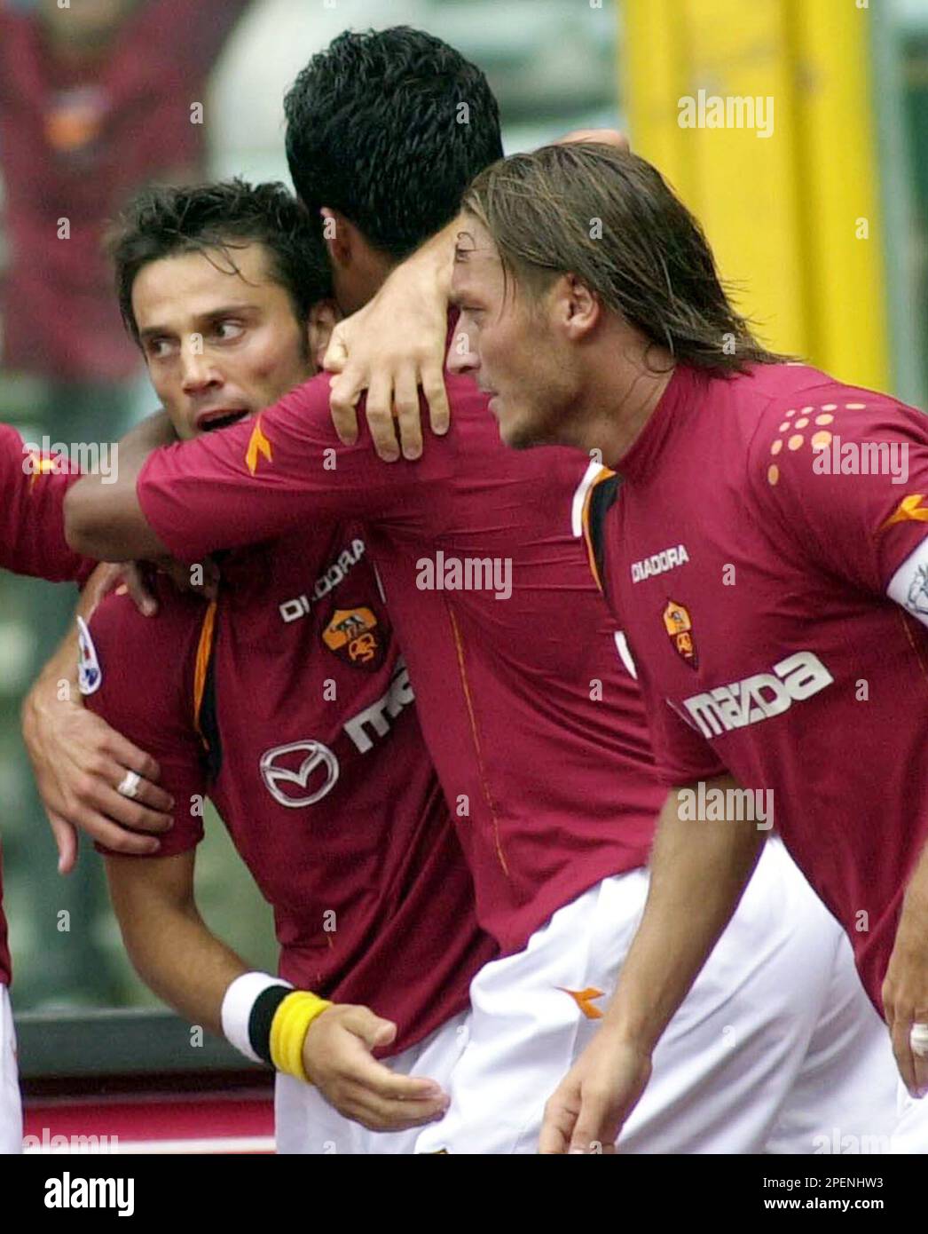 AS Roma's Vincenzo Montella, left, is hugged by teammates after he ...
