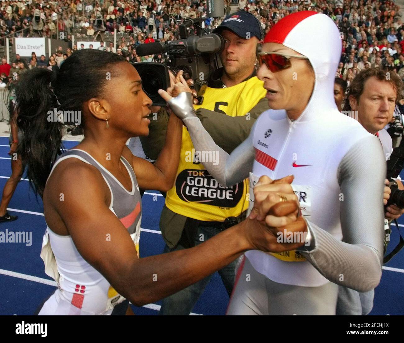 Tonique Williams-Darling of the Bahamas, left, celebrates with Mexico's ...