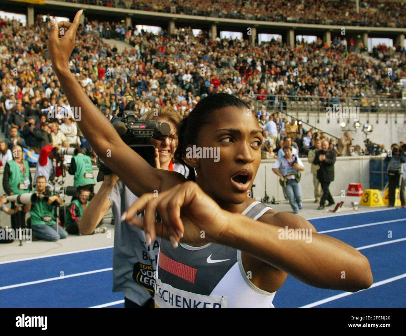 Tonique Williams-Darling of the Bahamas celebrates after she won the ...