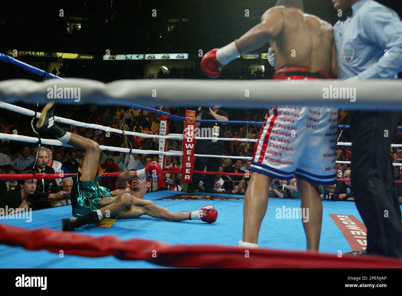 Miguel Cotto(R) knocks down Kelson Pinto in the sixth round to win the ...