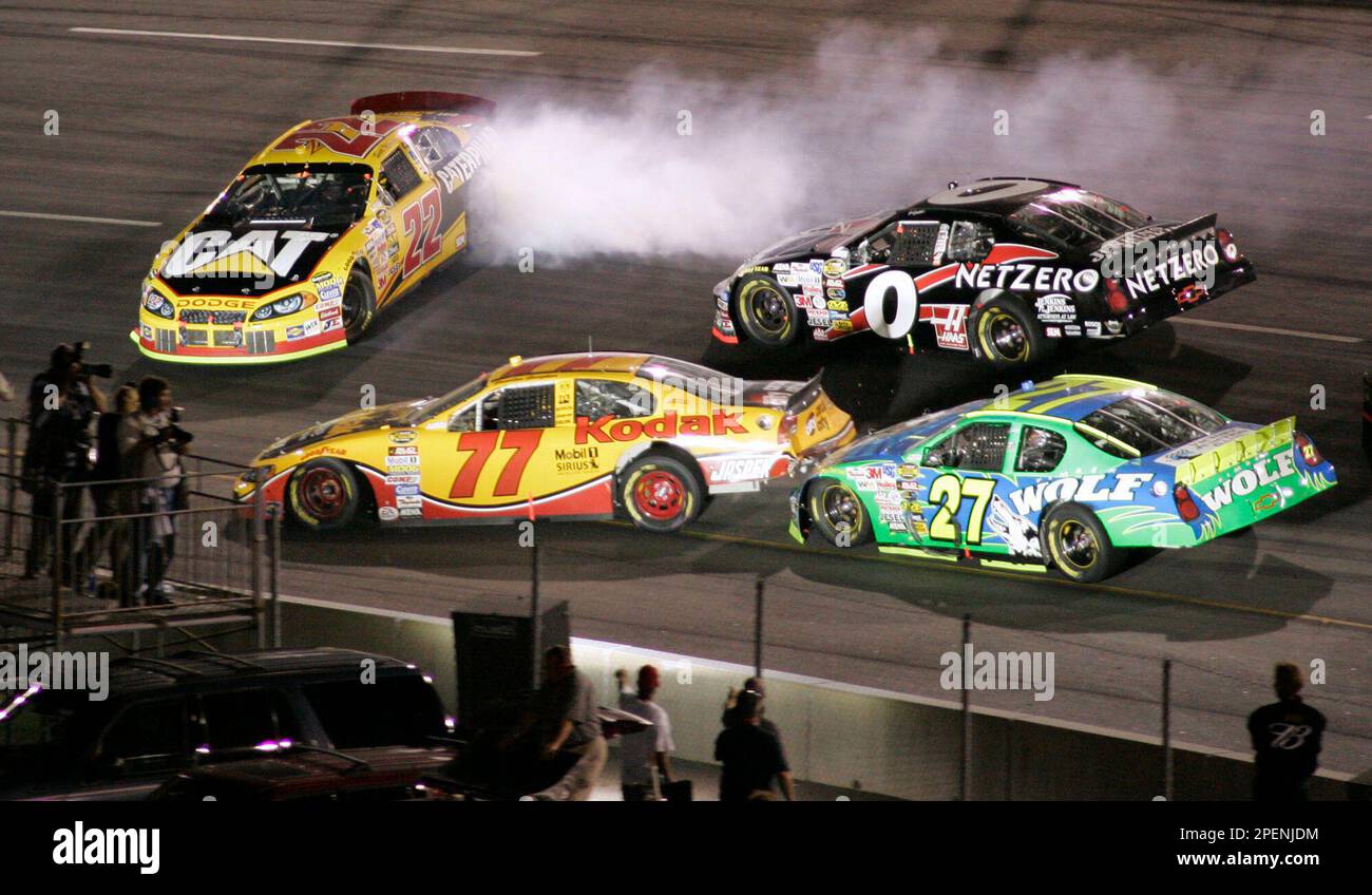 Scott Wimmer (22) and Brendan Gaughan (77) spin out in front of David ...