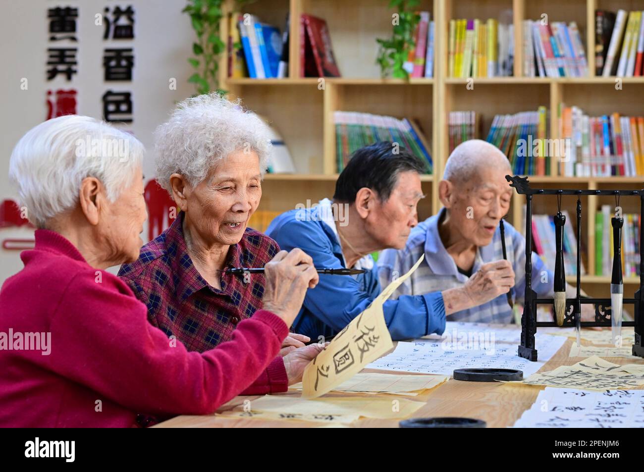 HOHHOT, CHINA - MARCH 16, 2023 - Senior citizens exchange calligraphy ...