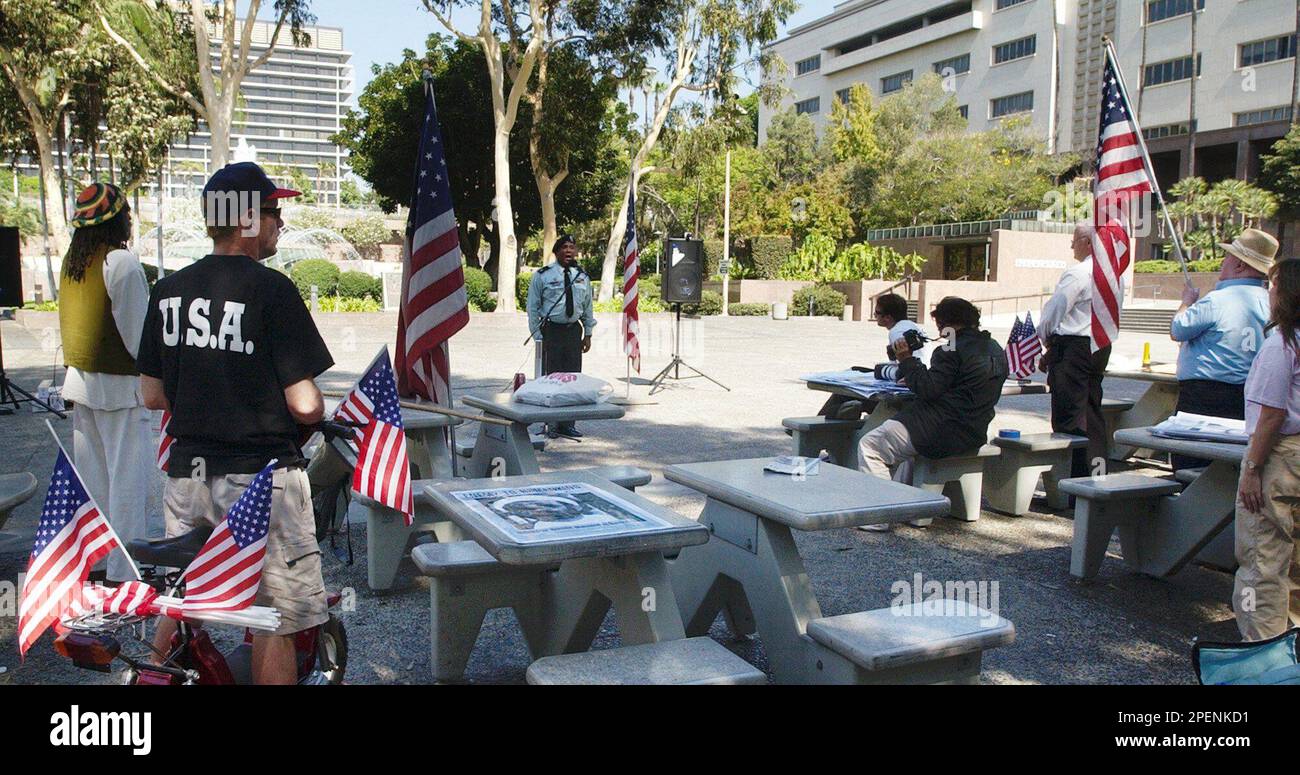 Staff Sgt. Michael Jackson, background center, sings the national ...