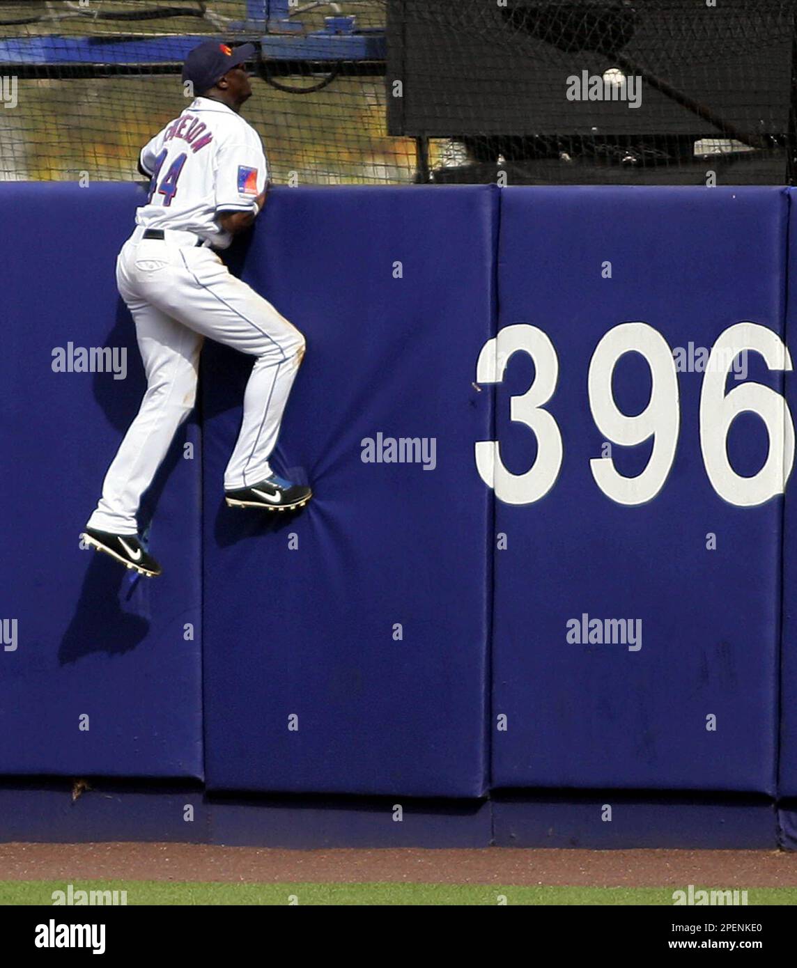 New York Mets Mike Cameron watches as a ball hit by Philadelphia ...