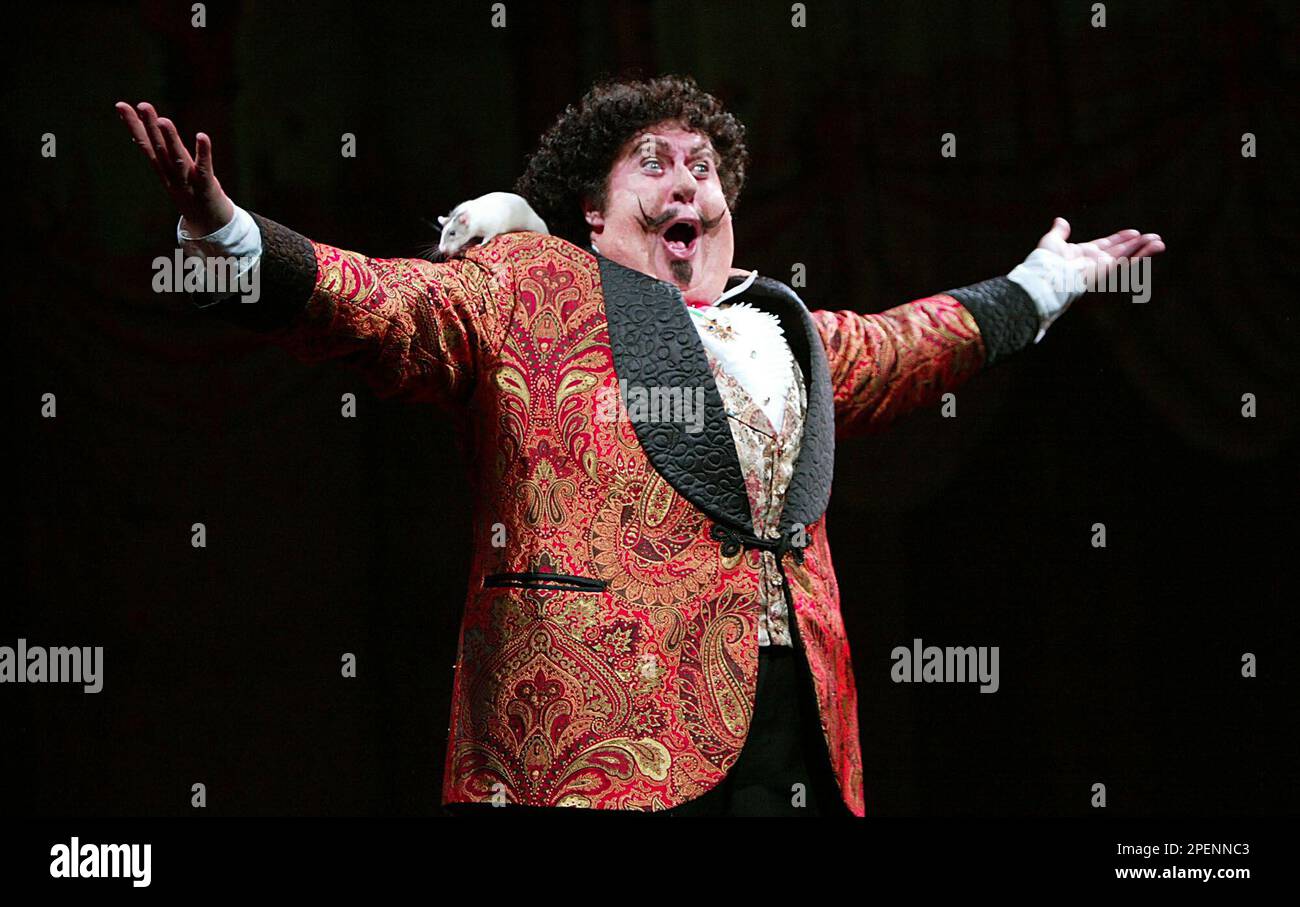 A heavily made-up Michael Crawford, playing Count Fosco, sings as a rat ...