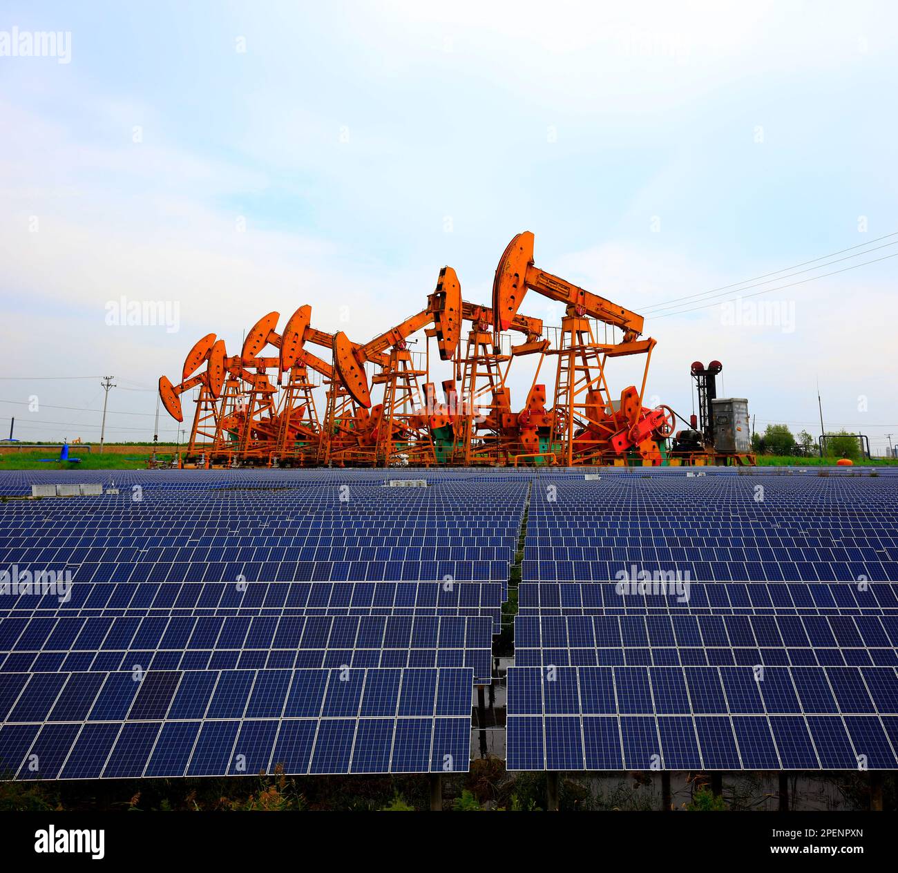 Oil pump with solar panels, industrial equipment Stock Photo - Alamy