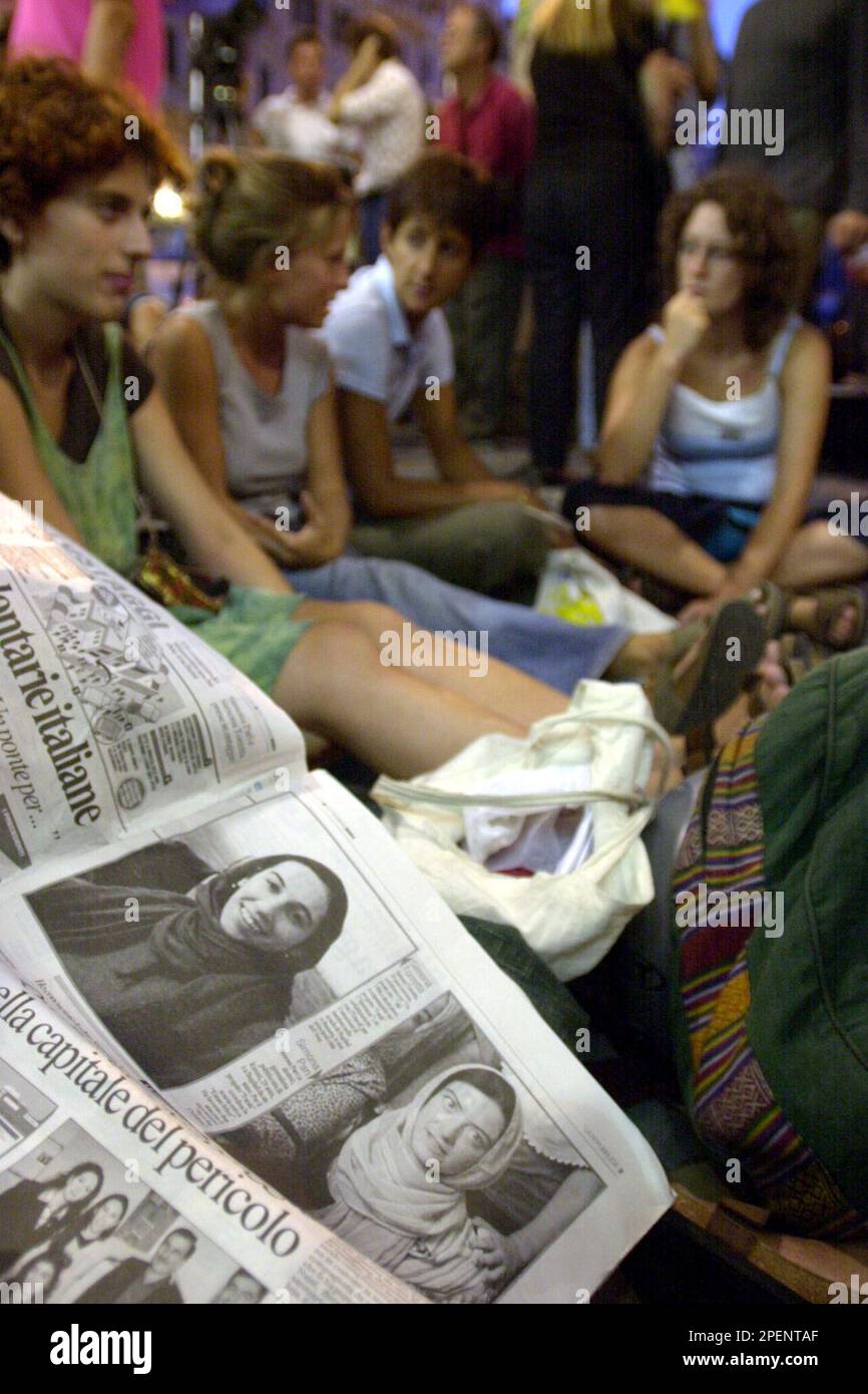 A newspaper showing the pictures of Simona Torretta and Simona Pari is ...