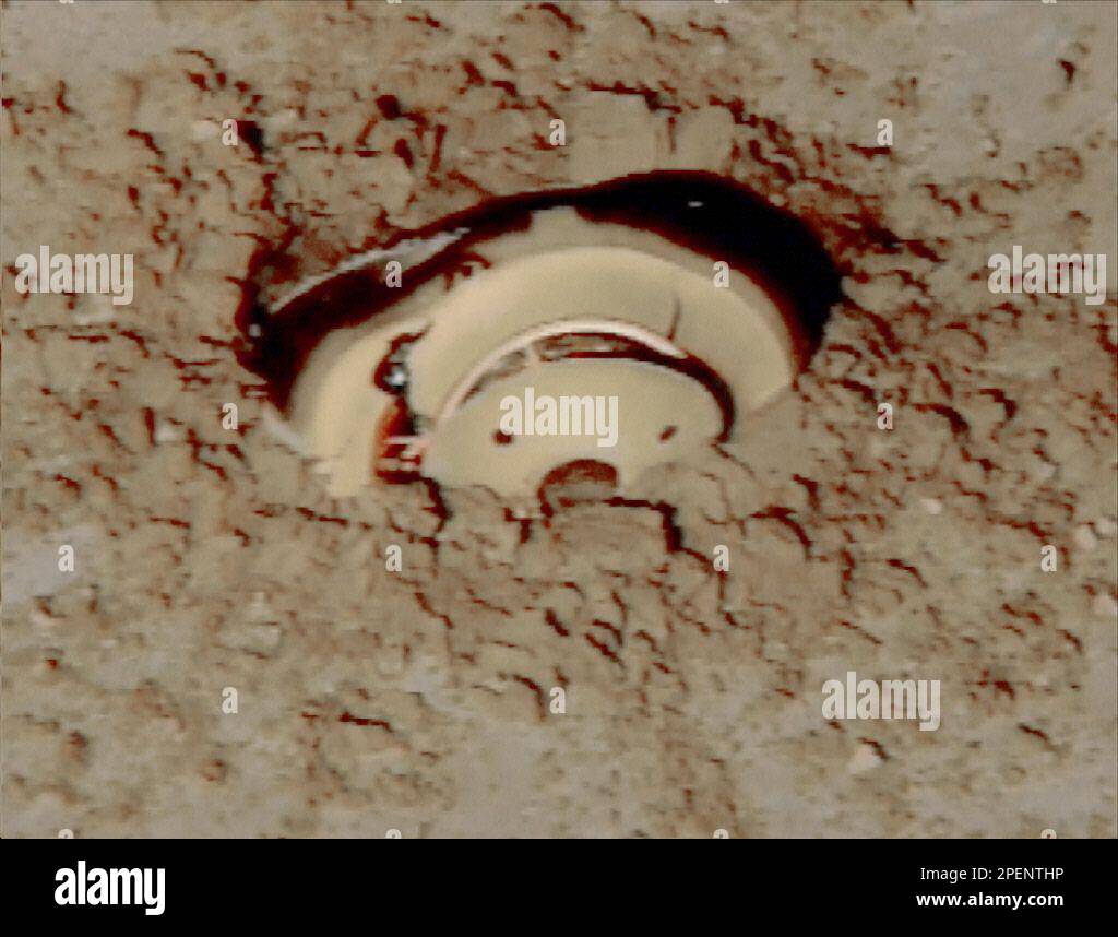 This image from television shows the Genesis space capsule after it ...