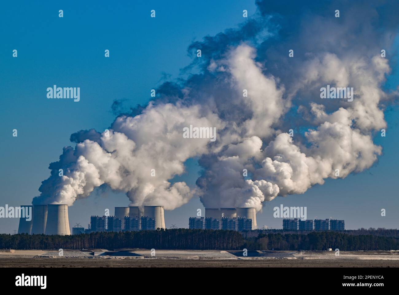 Steam rises from the cooling towers of the Jaenschwalde lignite-fired ...