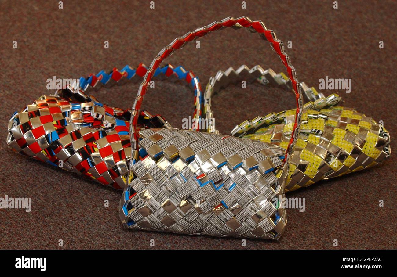 Three hand bags made by George Vargas out of potato chip bags, paper ...