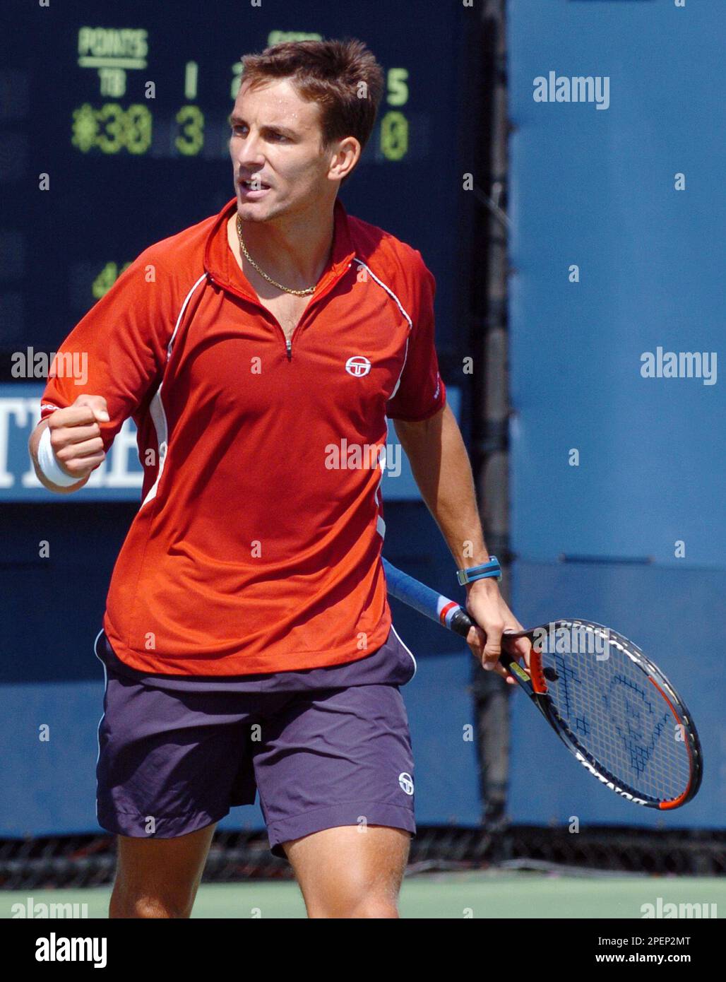 Tommy Robredo, of Spain, hits a return to Arnaud Clement, of France, at ...