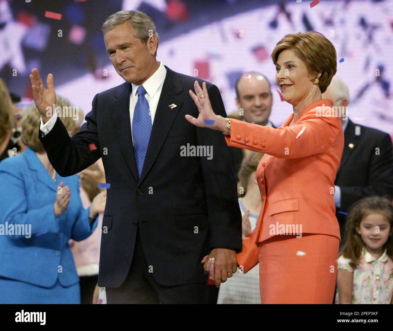 President Bush, left, and first lady Laura wave to delegates at the end ...