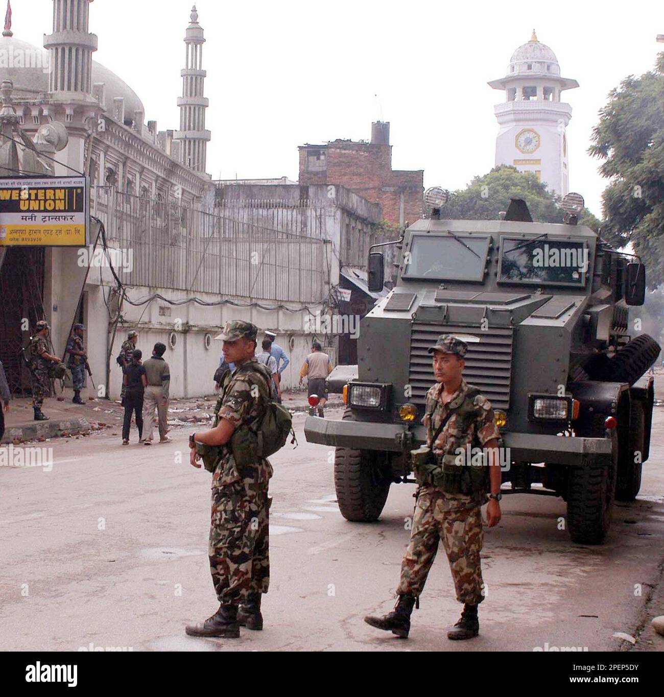 Soldiers stand guard outside the Jama Masjid mosque in Katmandu, Nepal ...