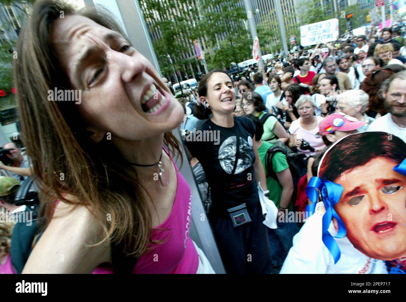 Carol Norris, left, and Andrea Buffa, center, lead protesters in anti ...