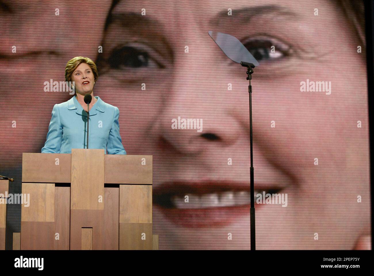 First lady Laura Bush is framed by her image on a giant video screen as ...