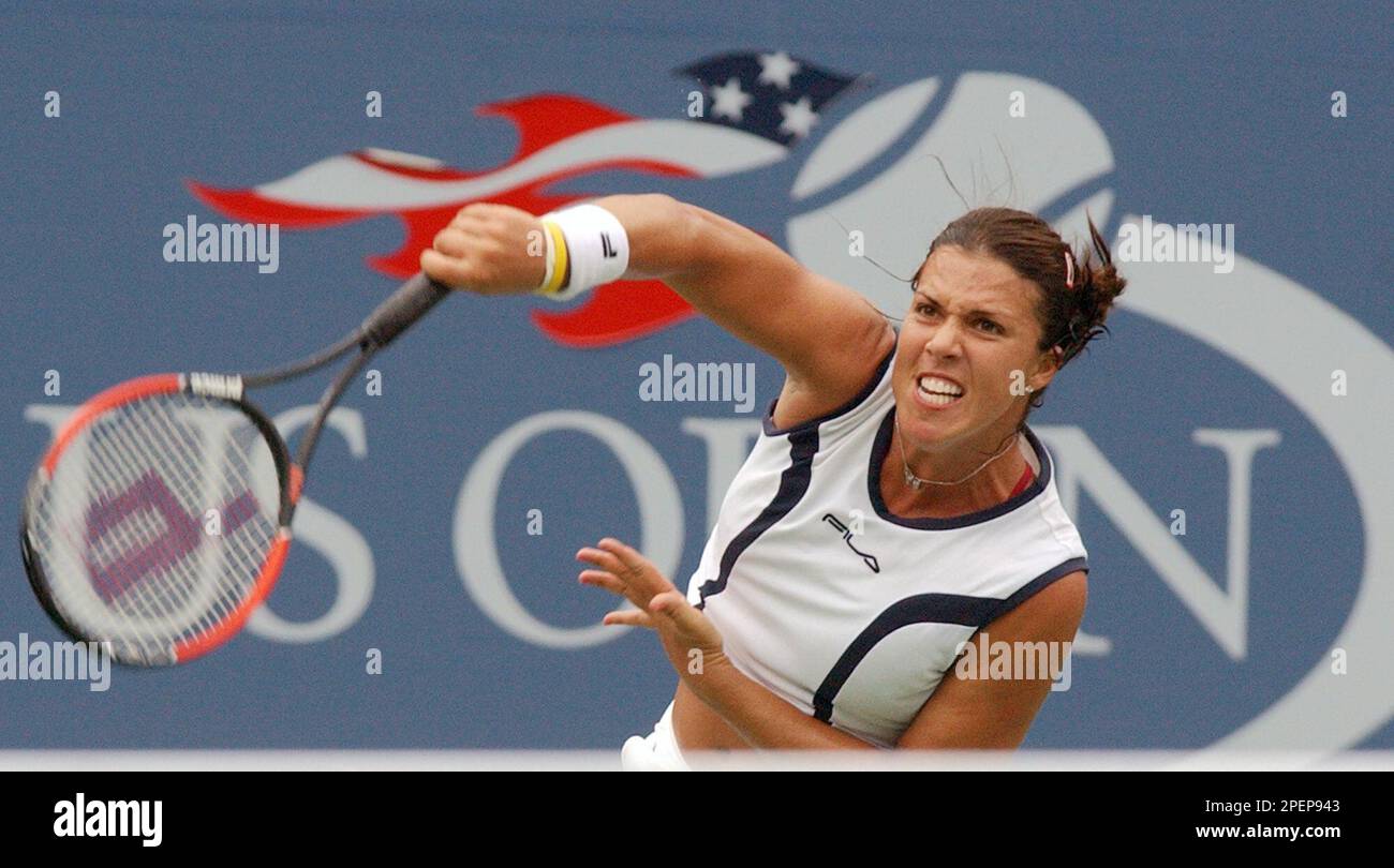 Jennifer Capriati follows through after returing a ball from Denisa ...