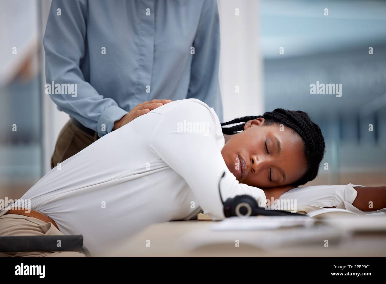 Tired, overworked and sleeping with black woman in call center office ...