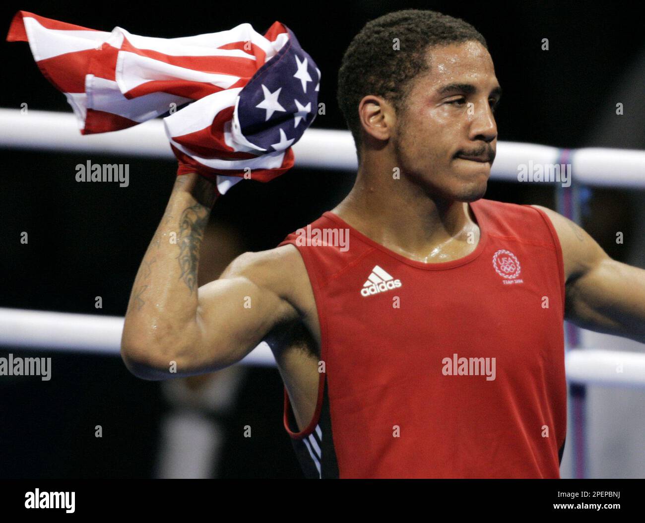 Andre Ward, from Oakland, Calif., waves the US flag as he celebrates ...