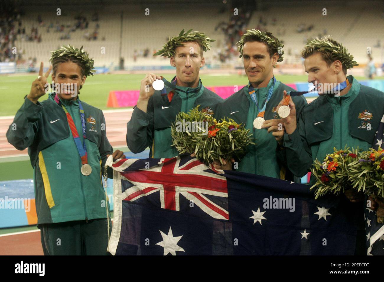 Australia's 4x400 meter relayt team pose with their silver medals ...