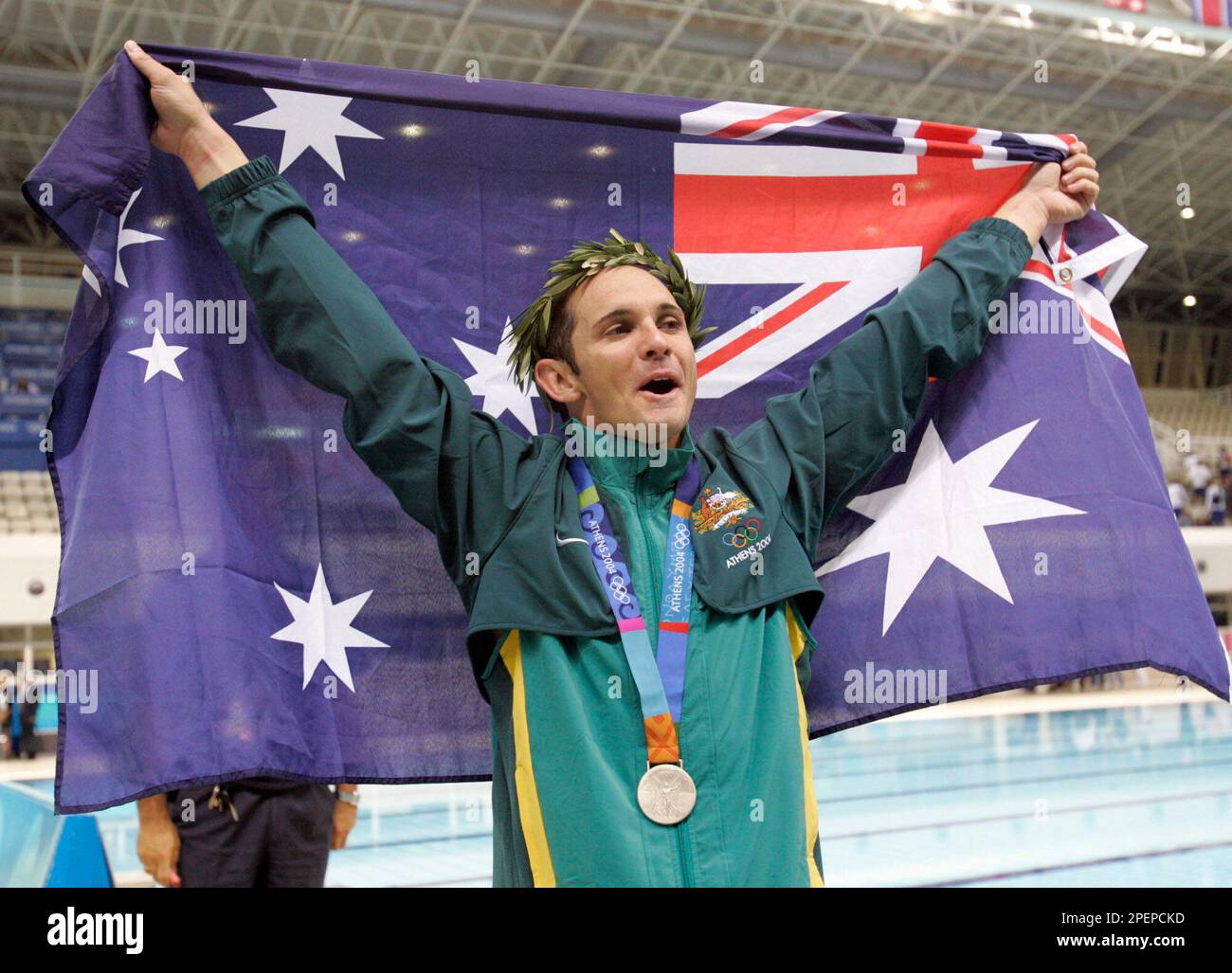 Mathew Helm of Australia waves his country's flag after taking the ...