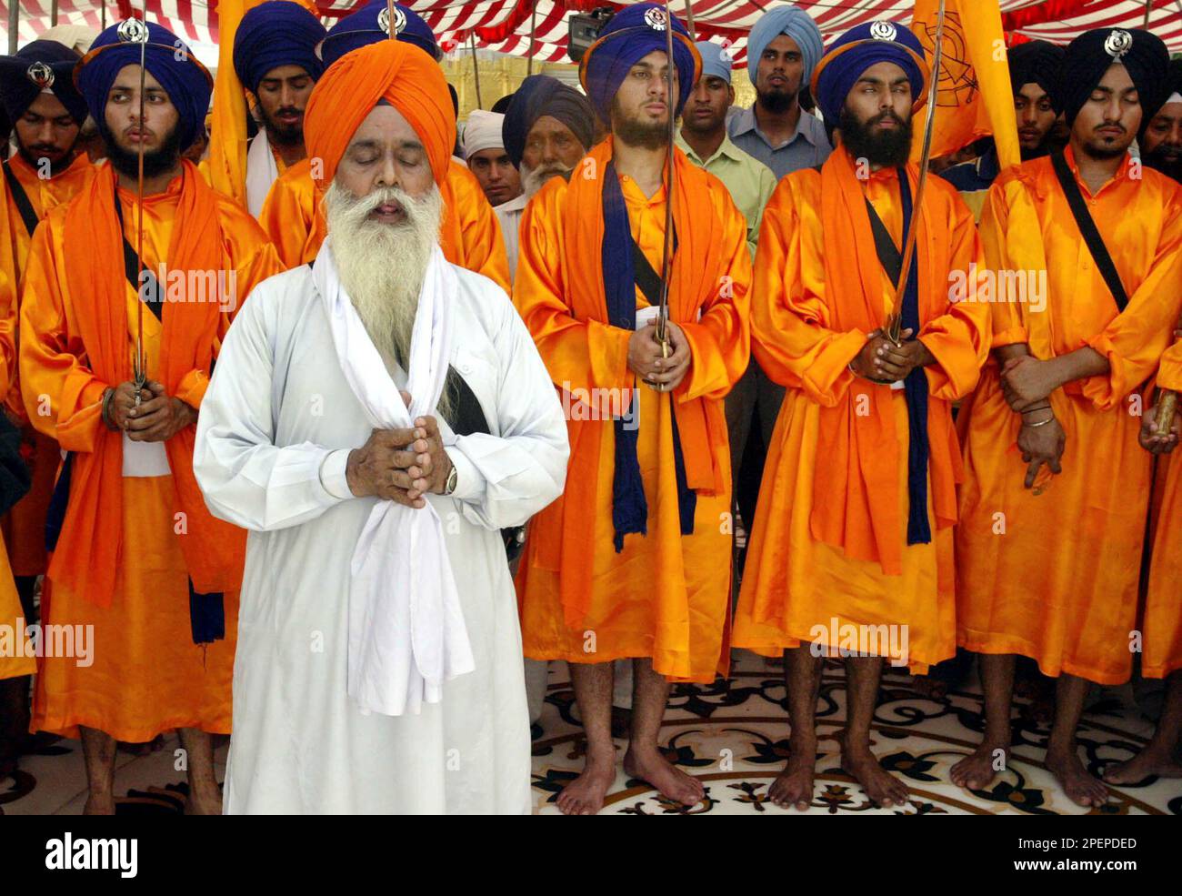 Baptised Sikhs pray inside the Golden Temple in Amritsar, India ...