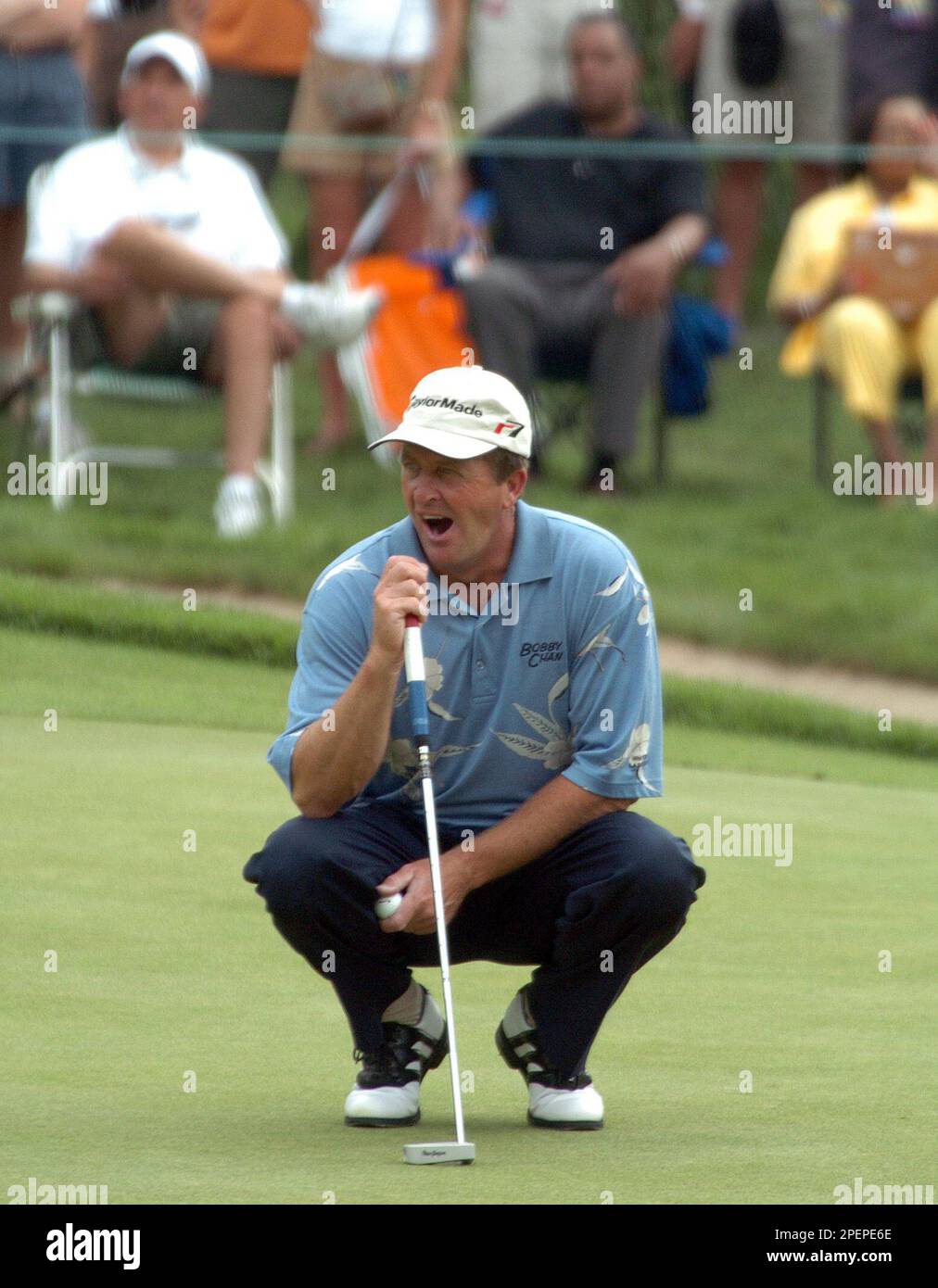 Fred Funk, from Ponte Vedra Beach, Fla., yawns as he waits his turn to ...