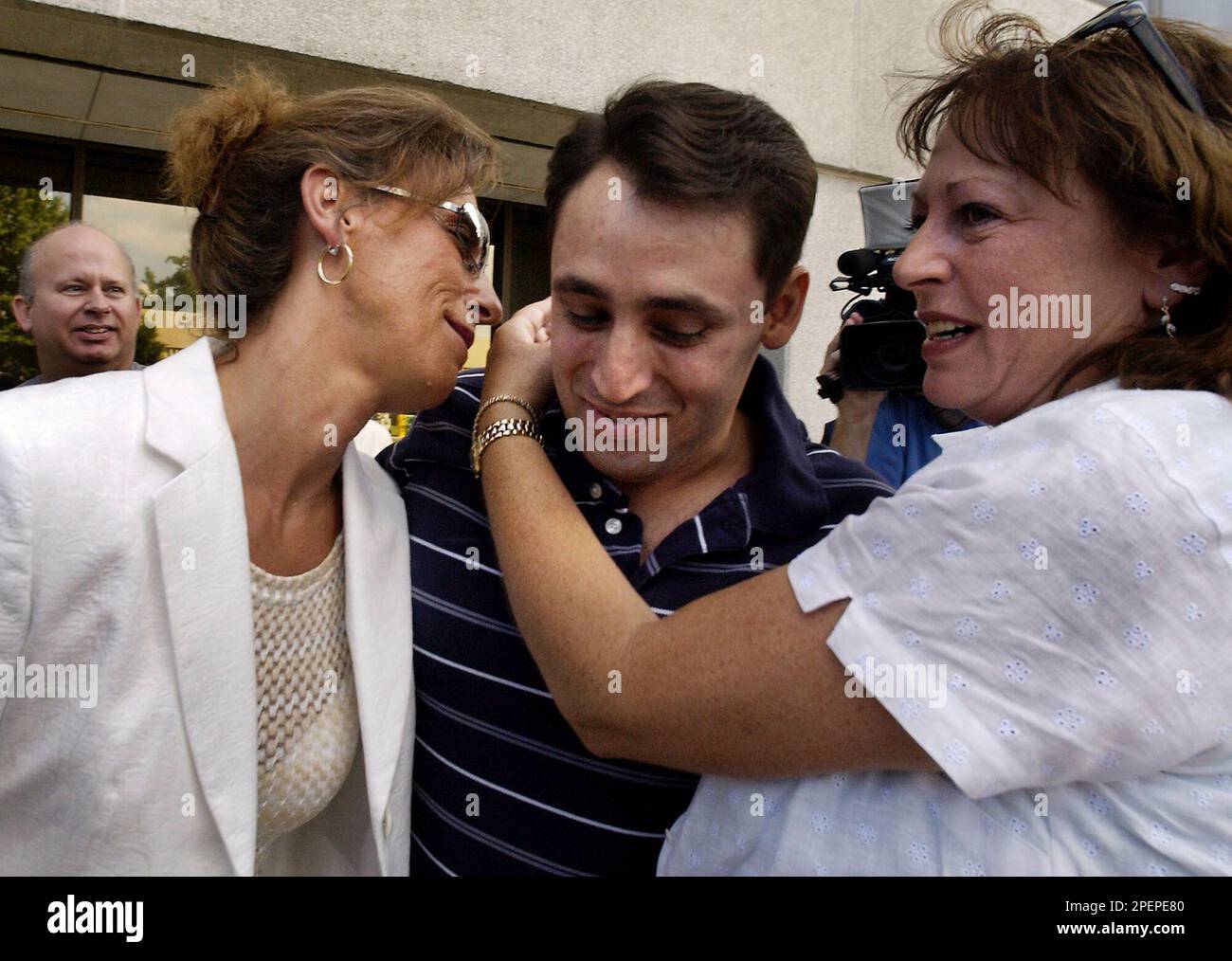 Former CIA contractor, David Passaro 38, center, is embraced by his ...